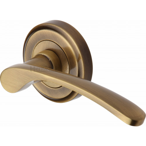 Classic Curved Lever Handles on Rose in Antique Brass from Cheshire ...